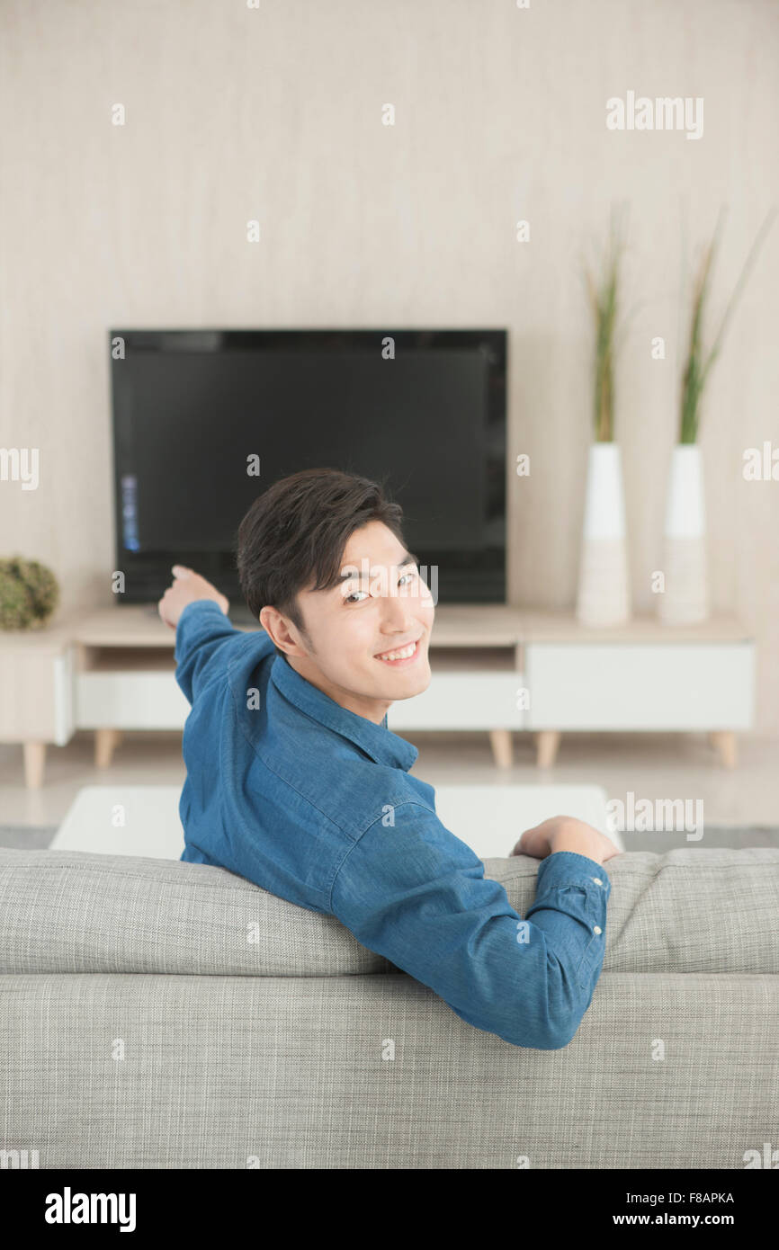 Man holding tv remote hi-res stock photography and images - Alamy