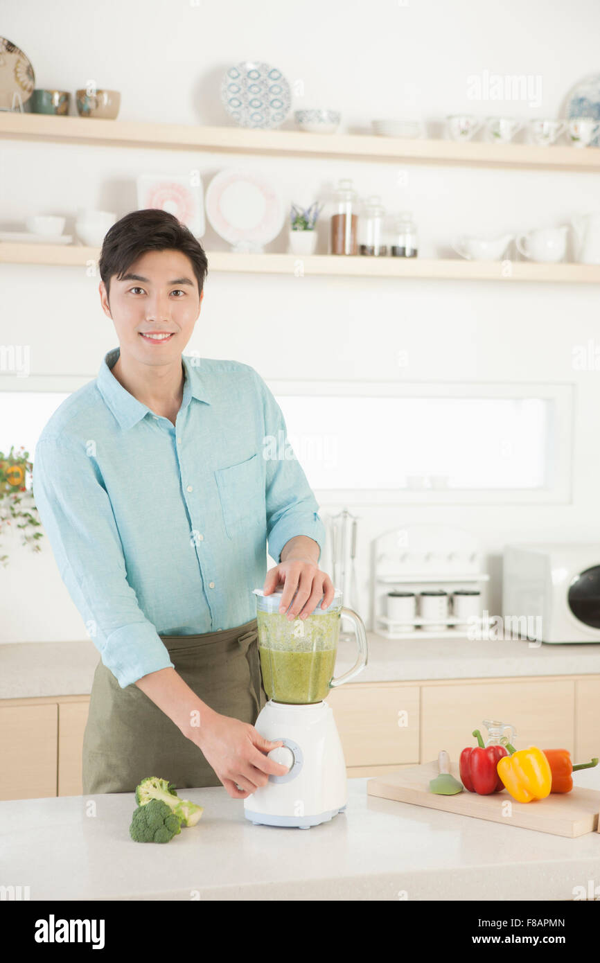 Man using blender in kitchen hi-res stock photography and images - Alamy