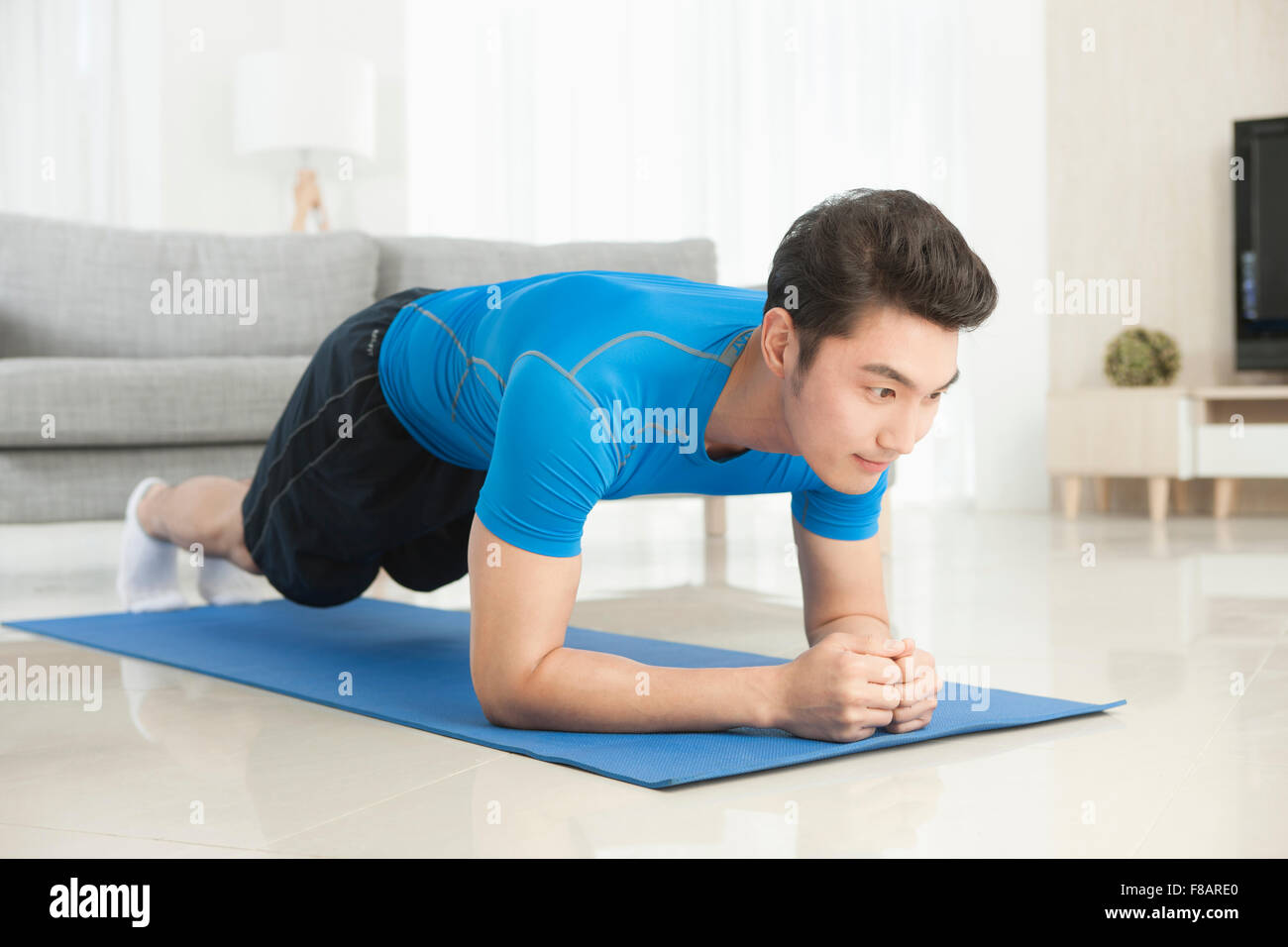 Man lying face down stretching hi-res stock photography and images - Alamy
