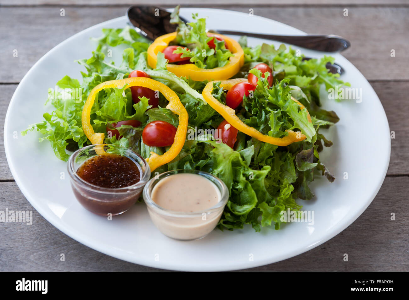 Vegetable salad on the wooden table Stock Photo - Alamy