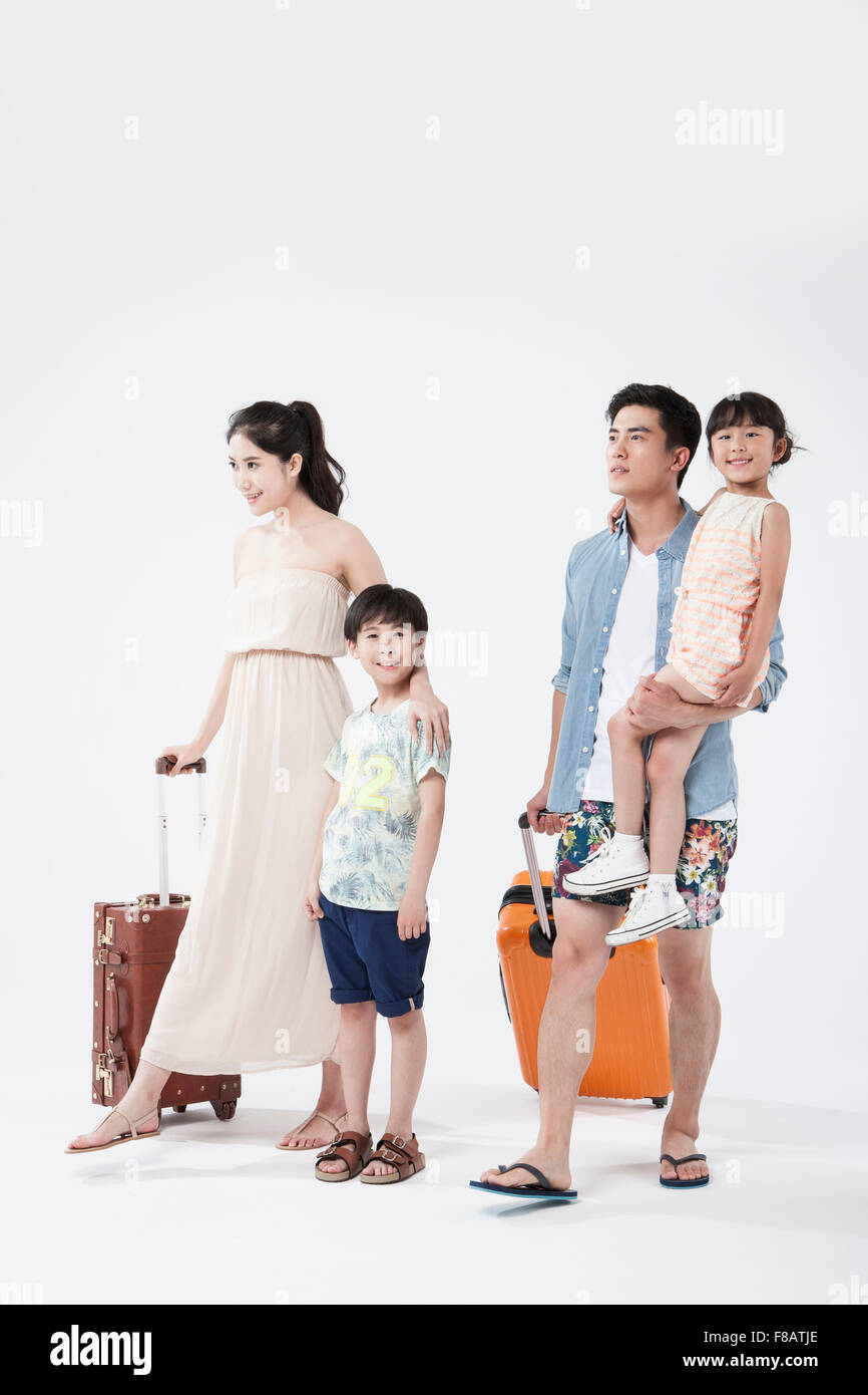 Family walking with carriers Stock Photo - Alamy