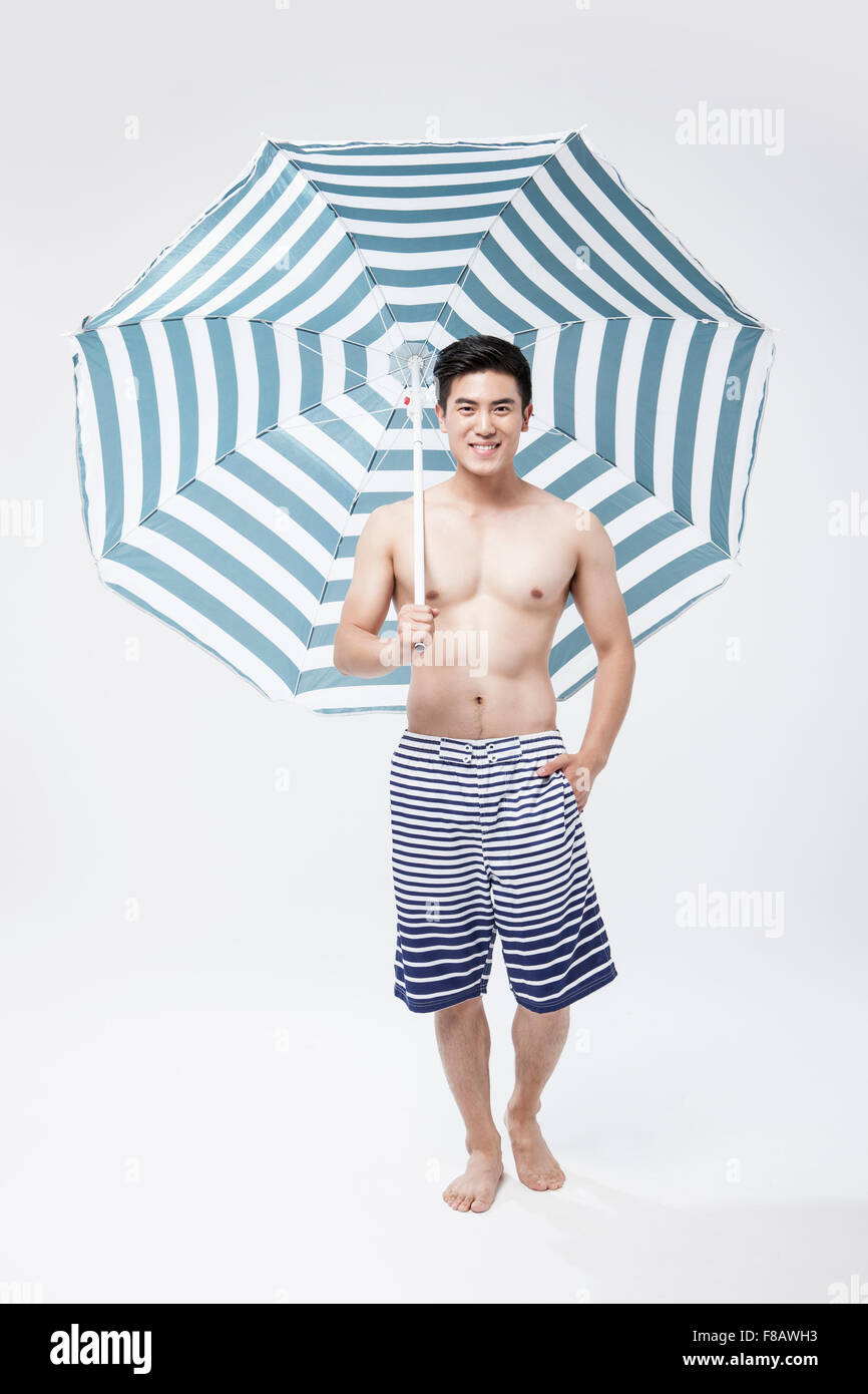 Man with parasol hi-res stock photography and images - Alamy