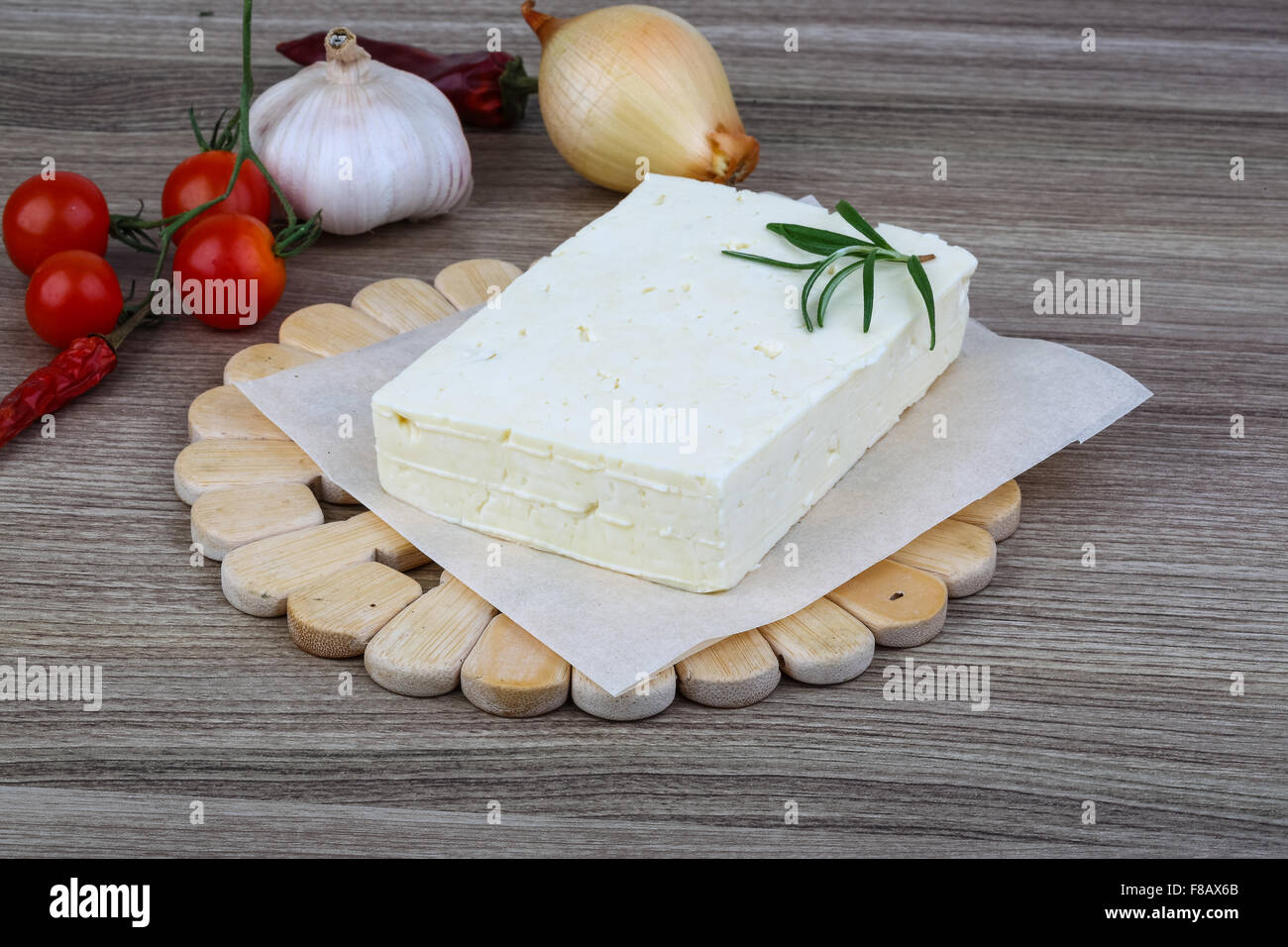Traditional Caucasian homemade Cheese Brinza with rosemary on wood ...