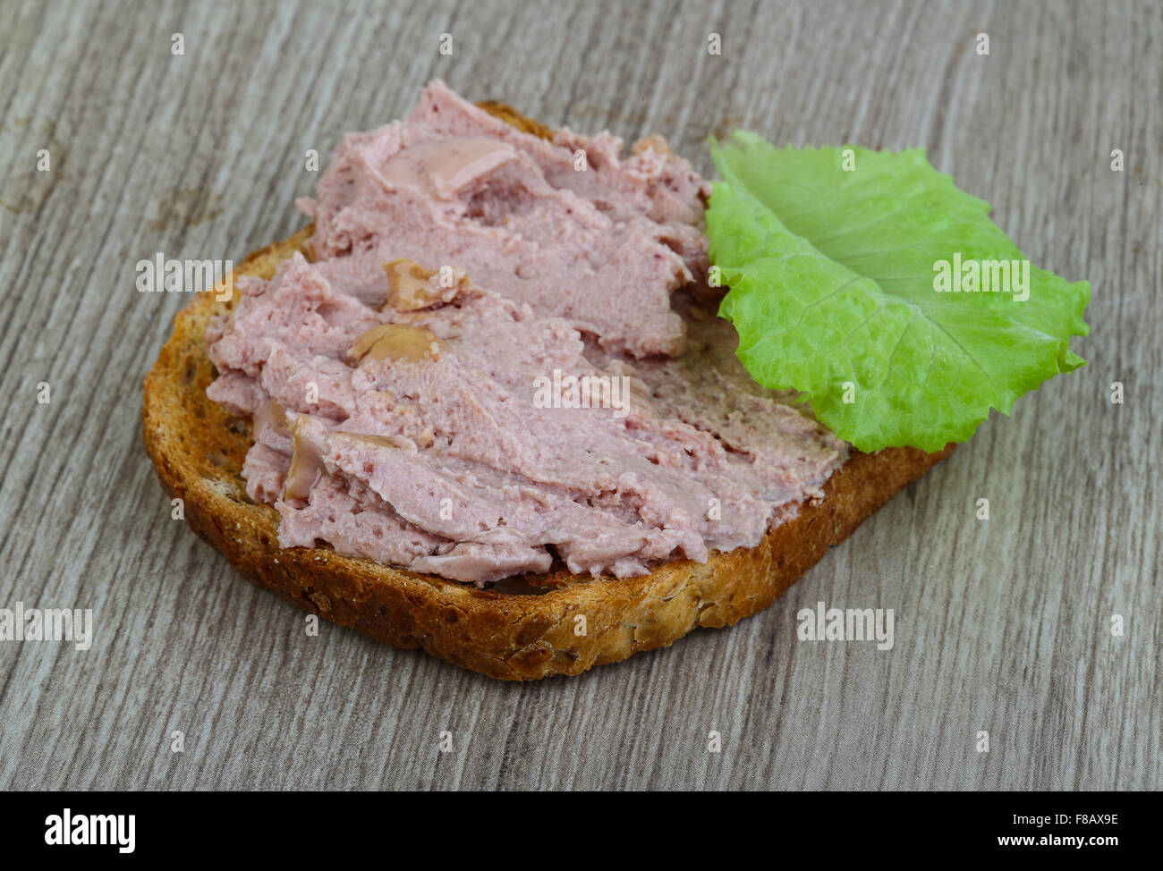 Pate sandwich with salad leaves on the wood background Stock Photo - Alamy