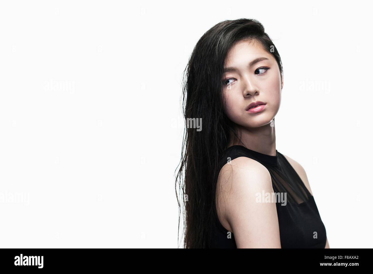 Side view portrait of young woman looking back Stock Photo - Alamy