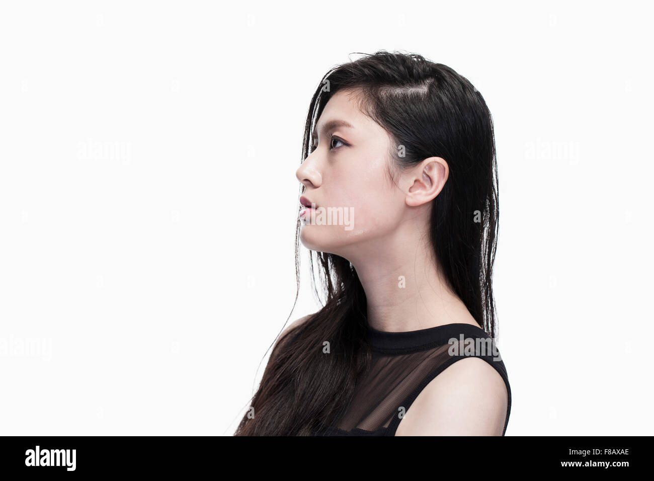 Side view portrait of young woman looking up Stock Photo - Alamy