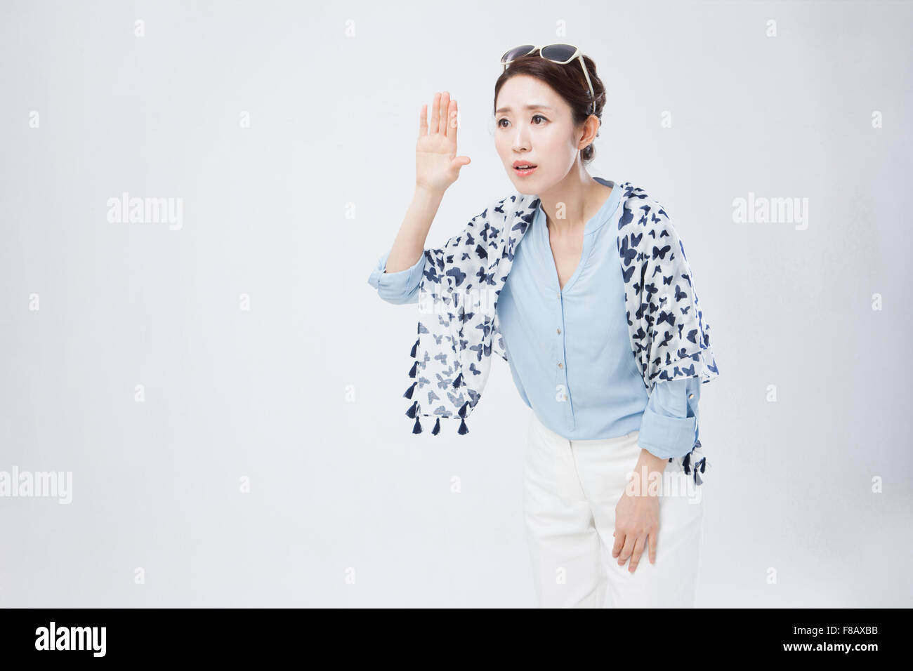 Woman raising a hand with smiling face Stock Photo - Alamy