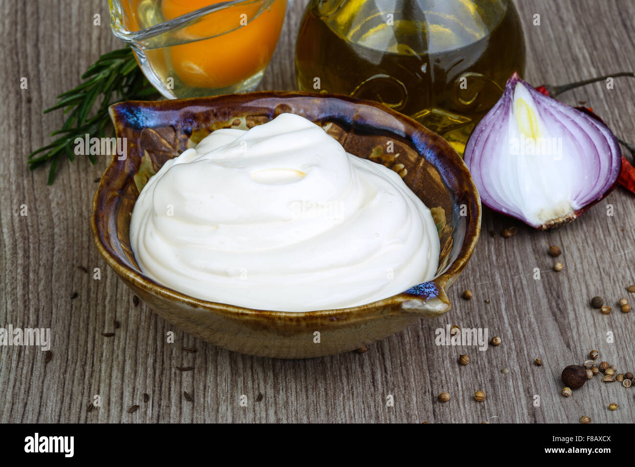 Mayonnaise sauce served raw egg, olive oil and rosemary Stock Photo - Alamy