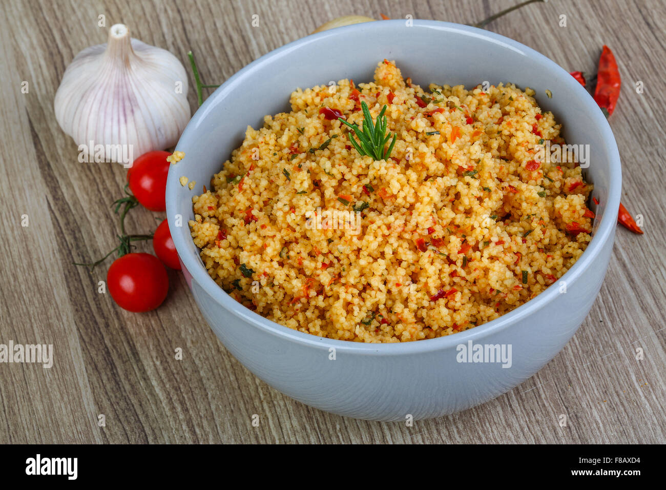 Arabic traditional cuisine - Couscous with tomato and green onion Stock ...