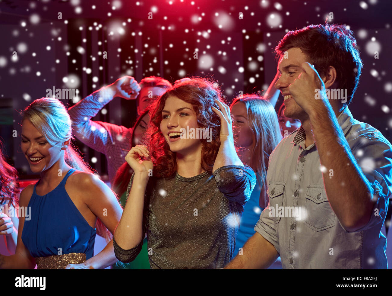 group of happy friends dancing in night club Stock Photo - Alamy