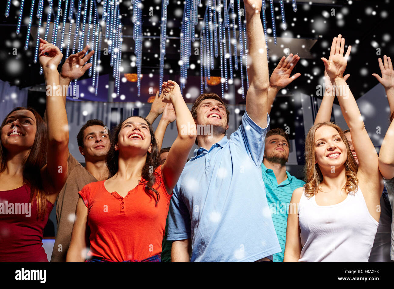 group of smiling friends at concert in club Stock Photo - Alamy