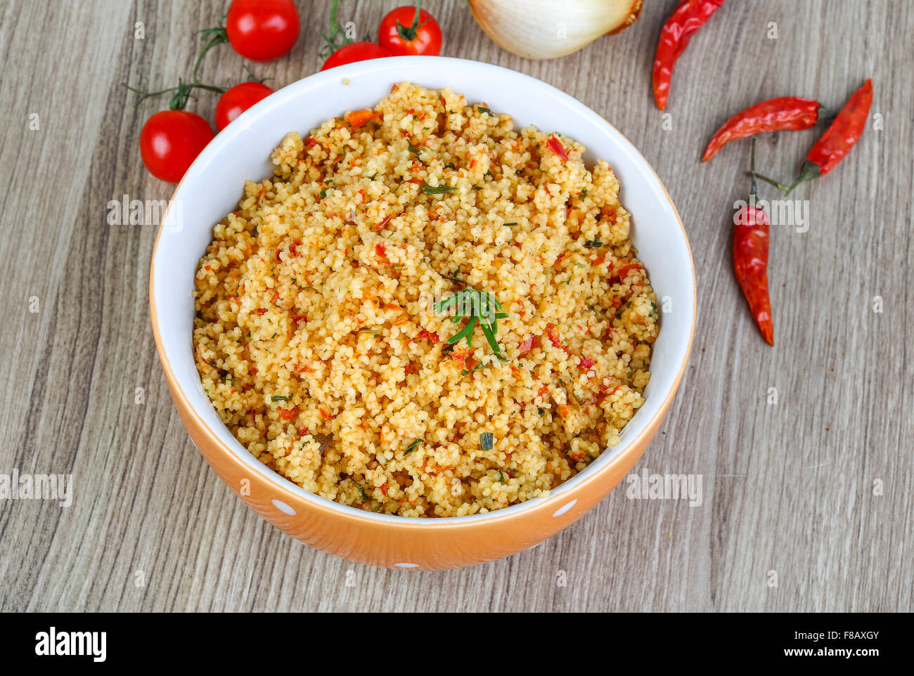 Arabic traditional cuisine - Couscous with tomato and green onion Stock ...