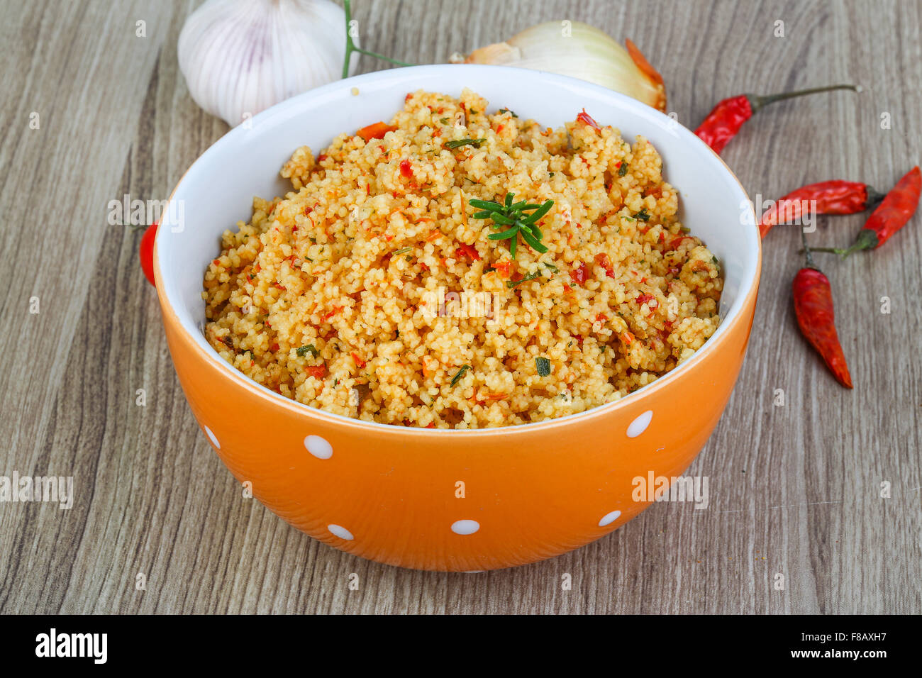 Arabic traditional cuisine - Couscous with tomato and green onion Stock ...
