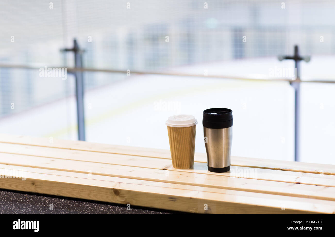 coffee and thermos cup on bench at ice rink arena Stock Photo - Alamy