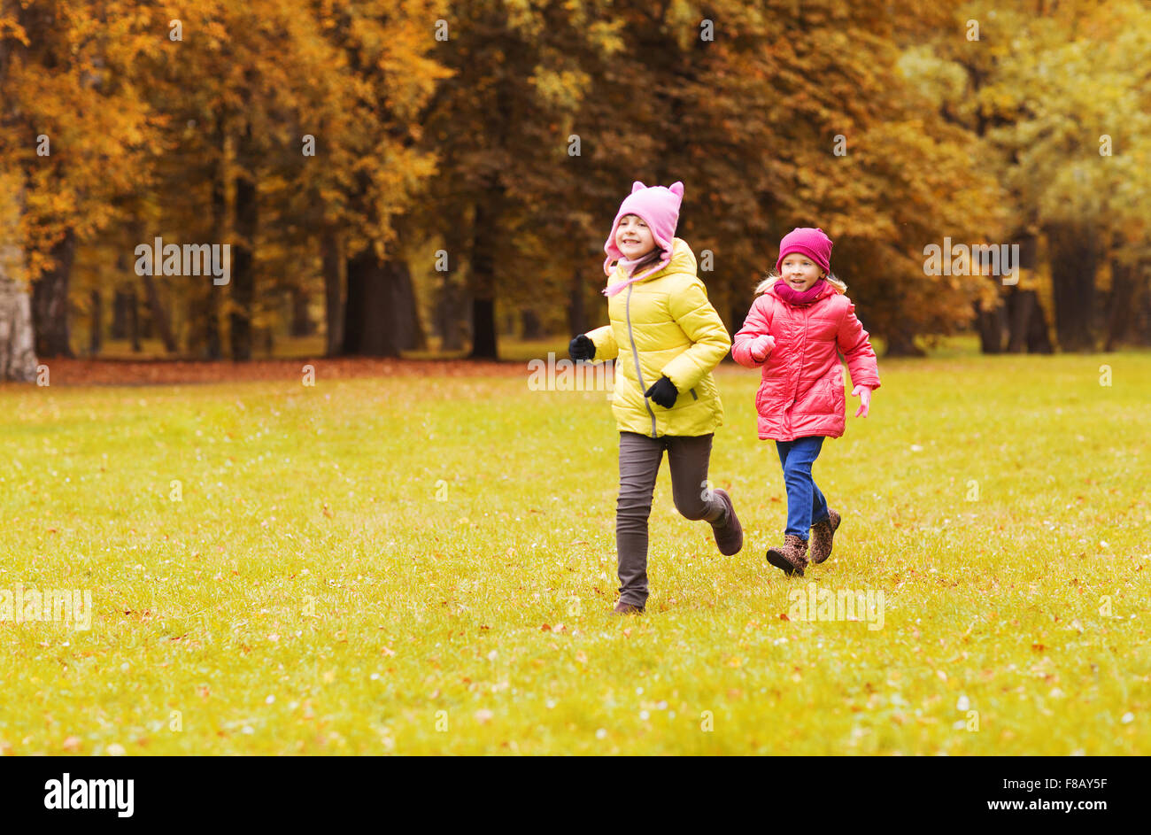 group of happy little girls running outdoors Stock Photo - Alamy