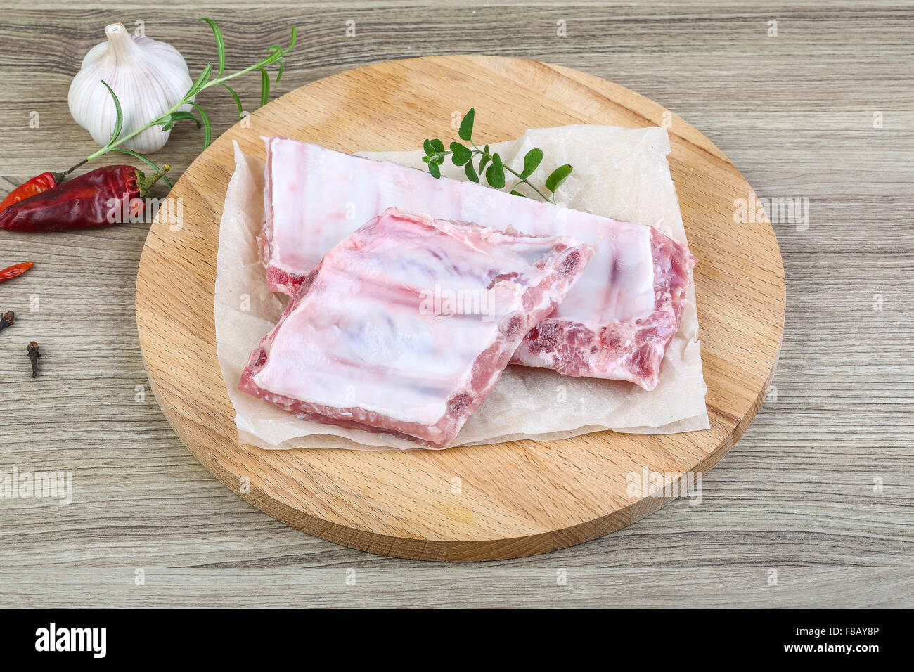 Raw pork ribs with herbs and spices ready for cooking Stock Photo - Alamy