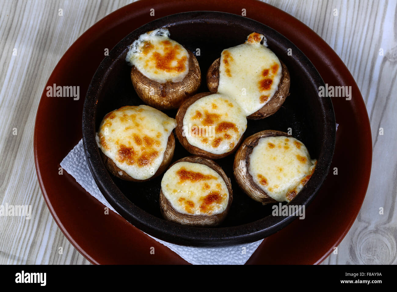Baked Stuffed champignon with hard cheese and spices Stock Photo - Alamy