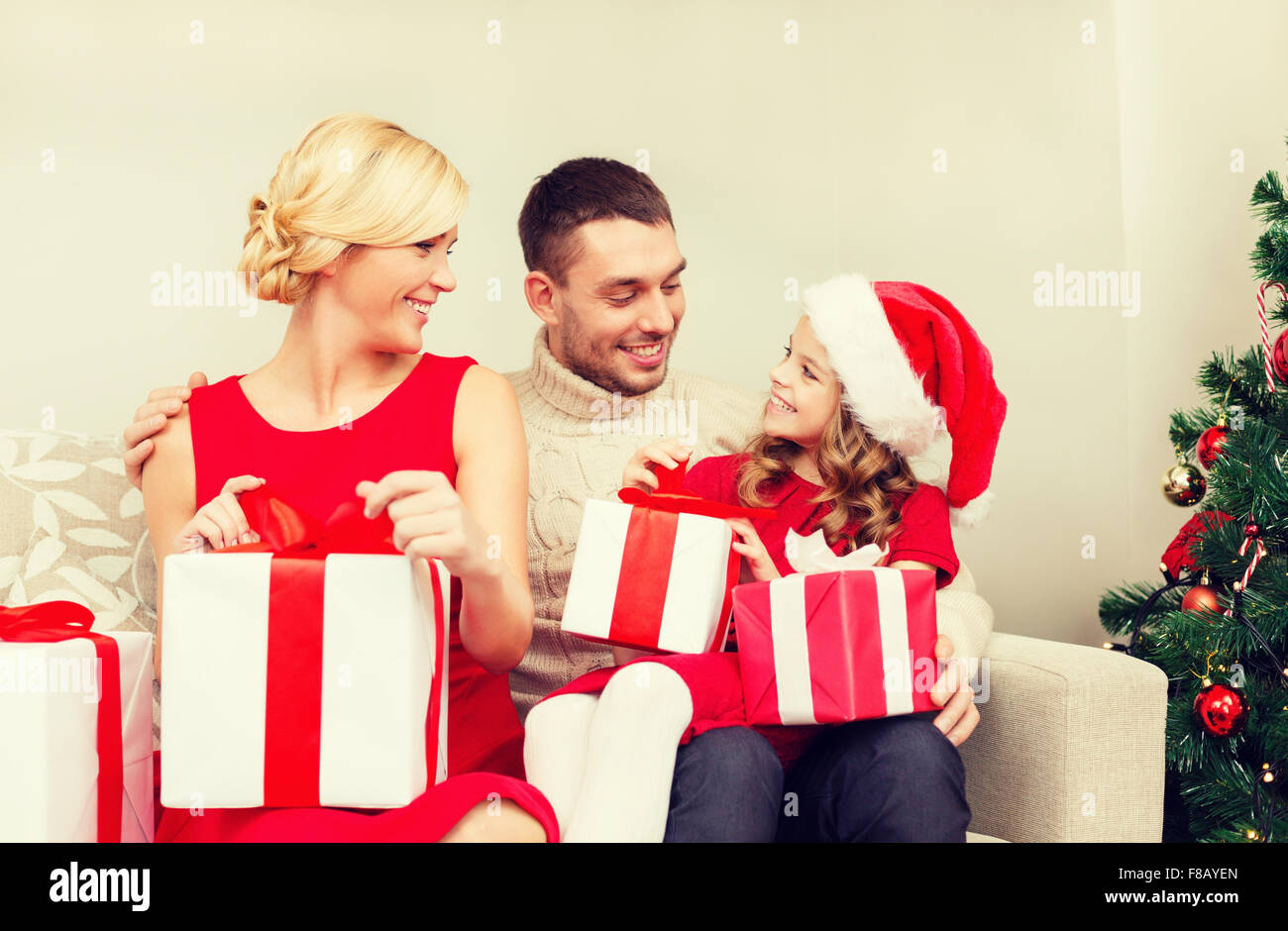 happy family opening gift boxes Stock Photo - Alamy