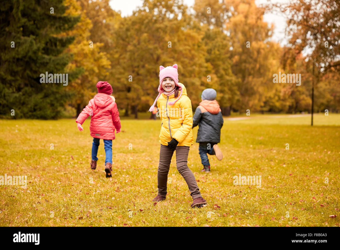 group of happy little kids running outdoors Stock Photo - Alamy