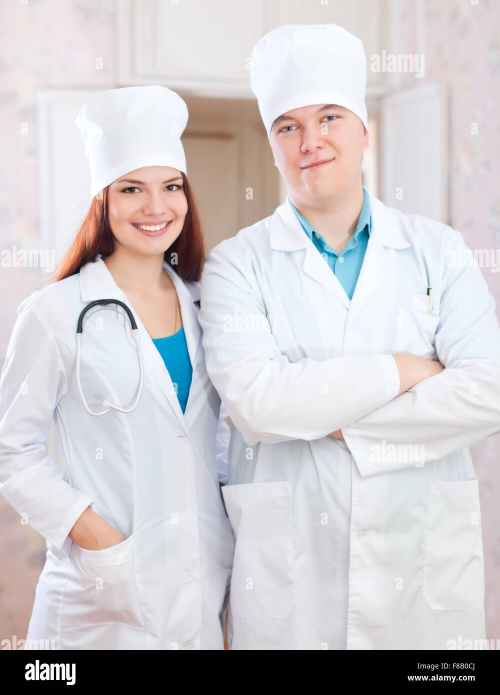 Portrait of friendly doctors in clinic interior Stock Photo - Alamy