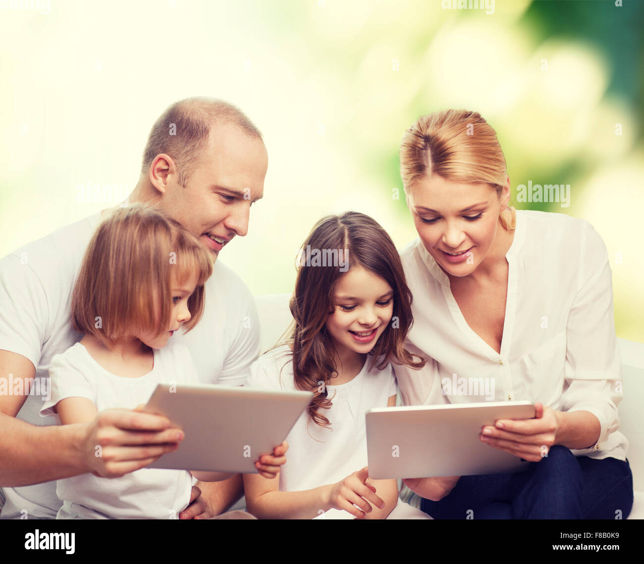 happy family with tablet pc computers Stock Photo - Alamy