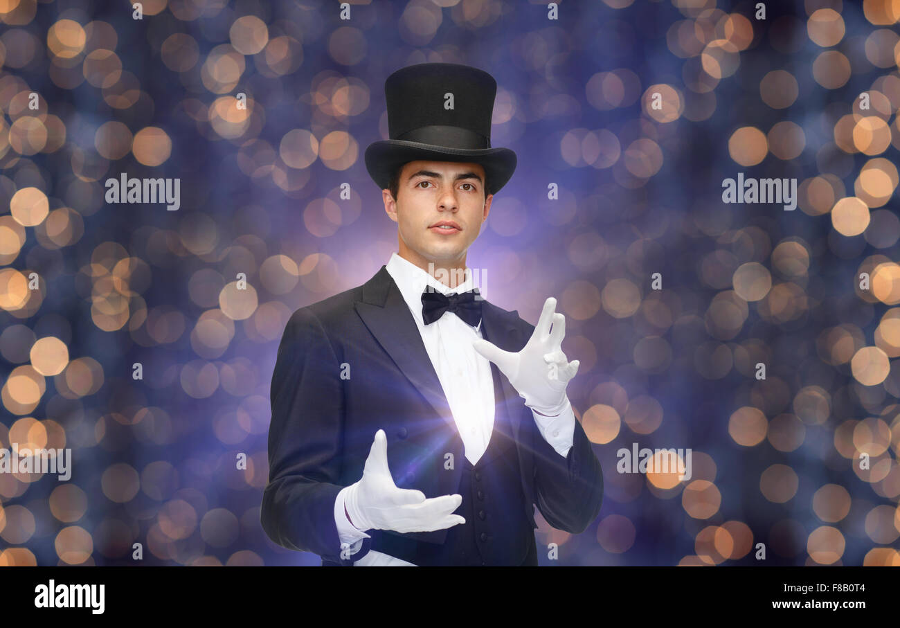 magician in top hat showing trick Stock Photo - Alamy
