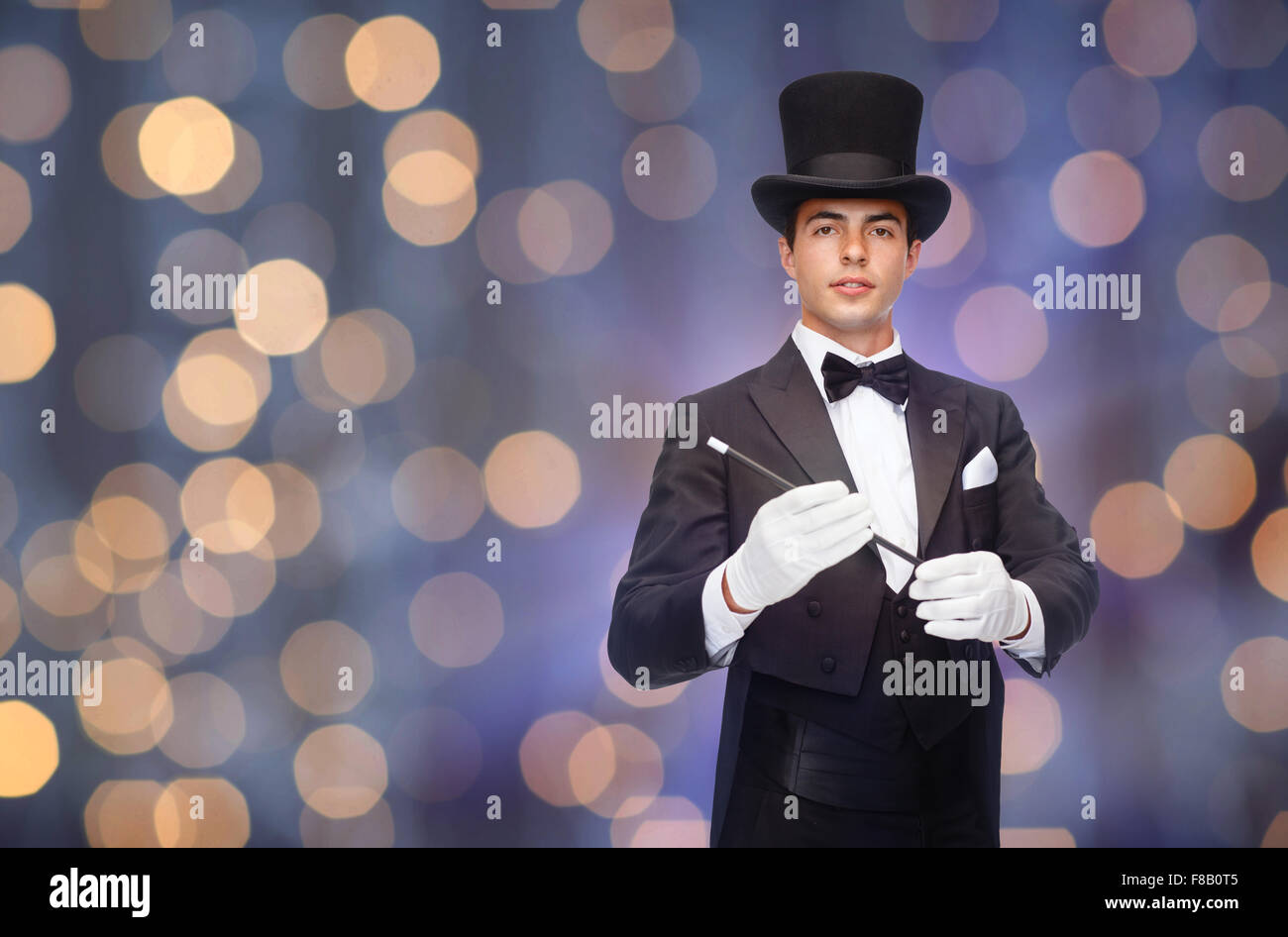 magician in top hat with magic wand Stock Photo - Alamy