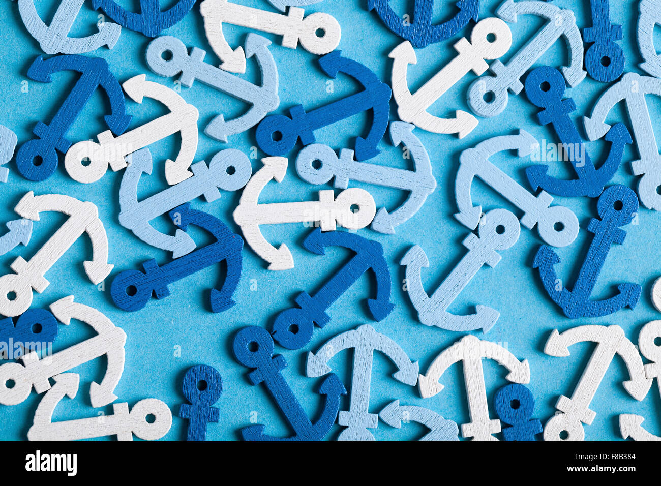 the small anchor close-up on a blue background Stock Photo - Alamy