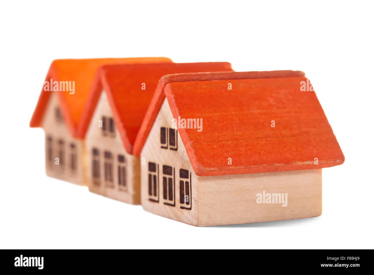Row of wooden toy house on white background Stock Photo - Alamy