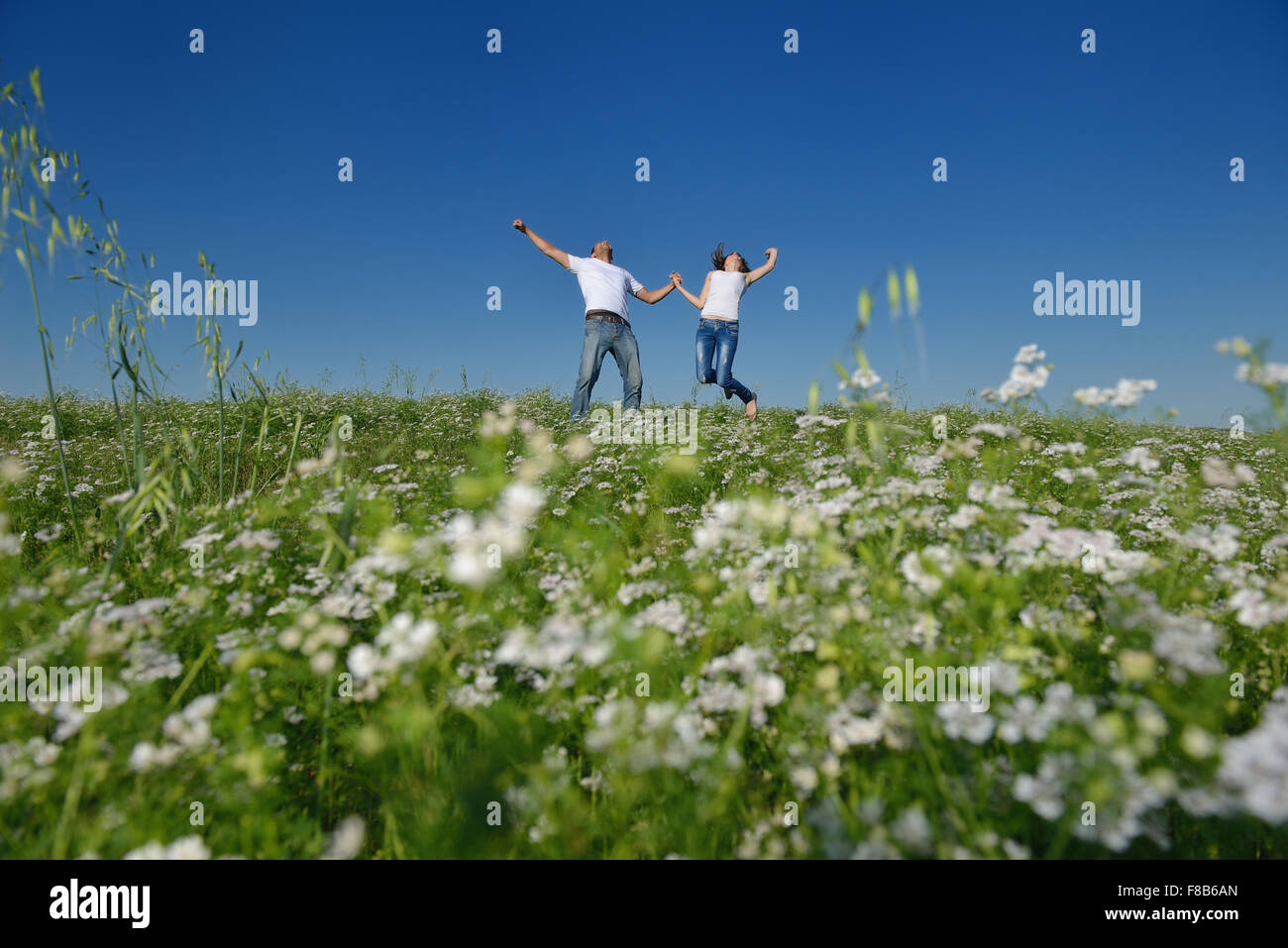 happy young couple in love have romance and fun at wheat field in ...