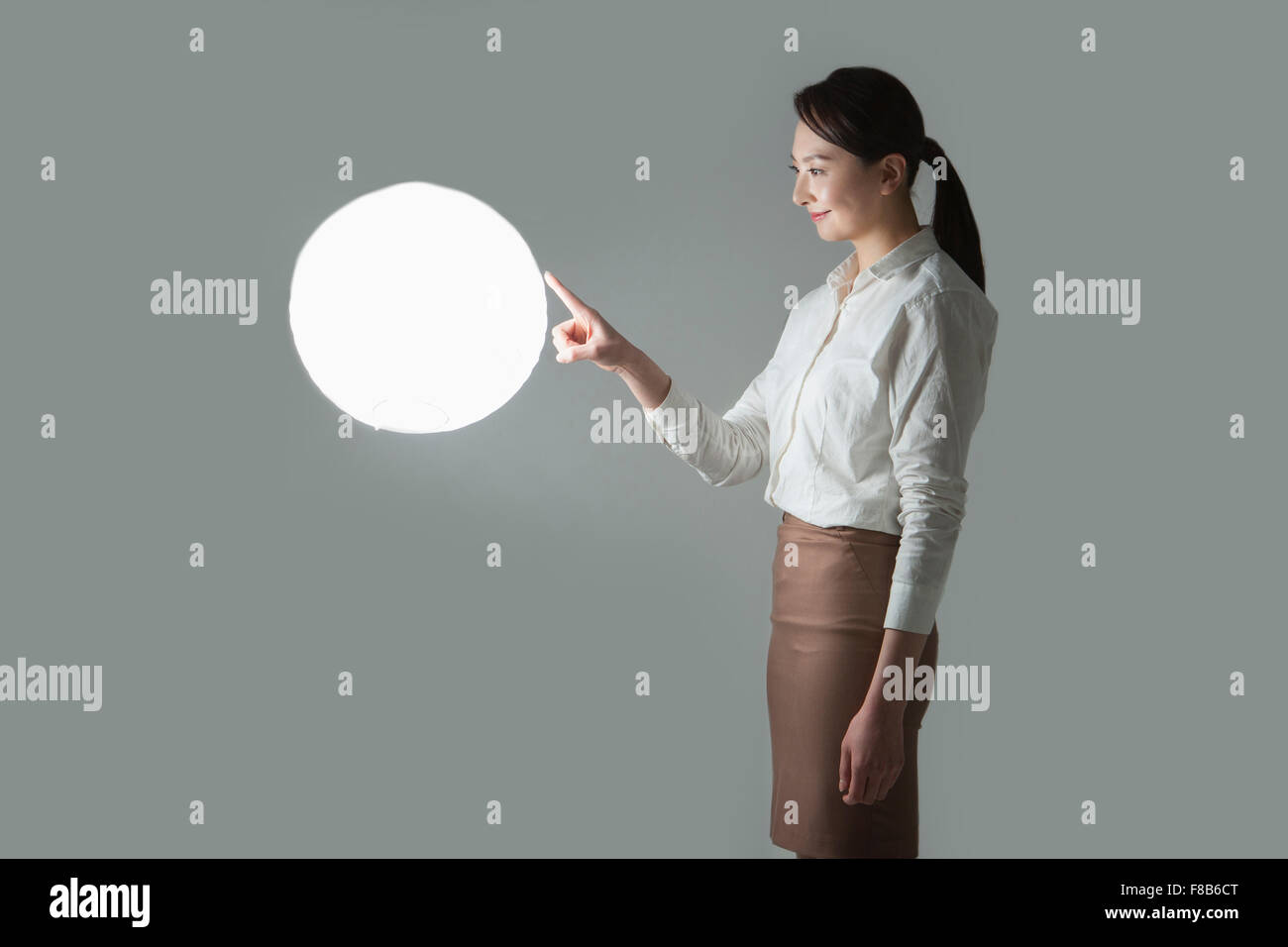 Circular copy space with business woman pointing with her finger Stock ...
