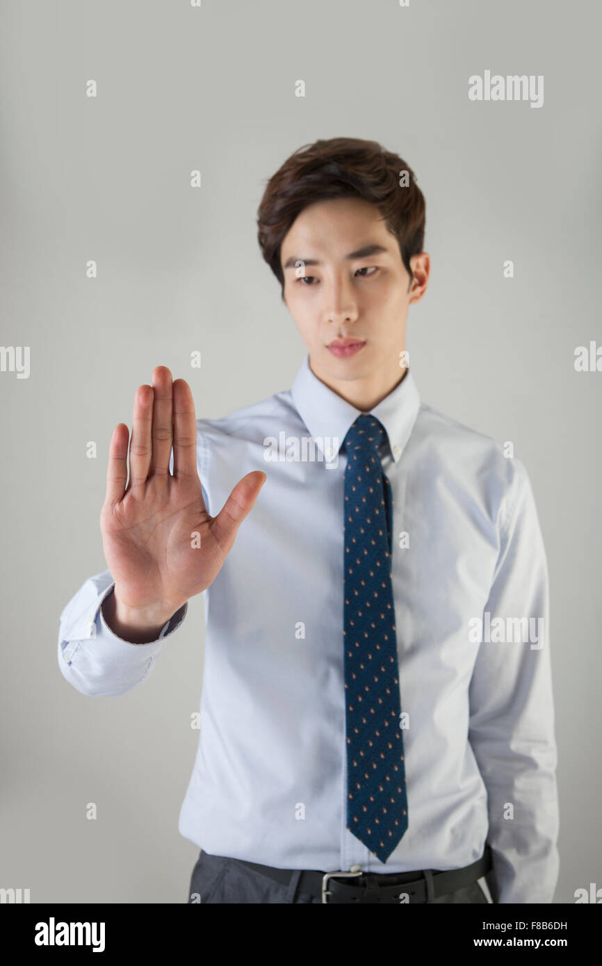 Businessman touching a screen with his palm Stock Photo - Alamy