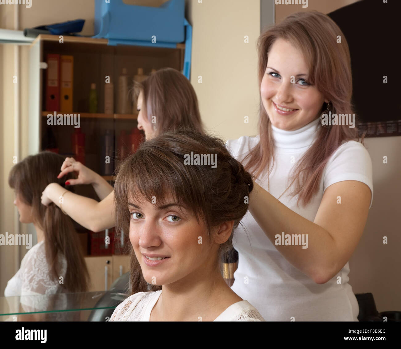 Professional hairstylist works on hi-res stock photography and images ...