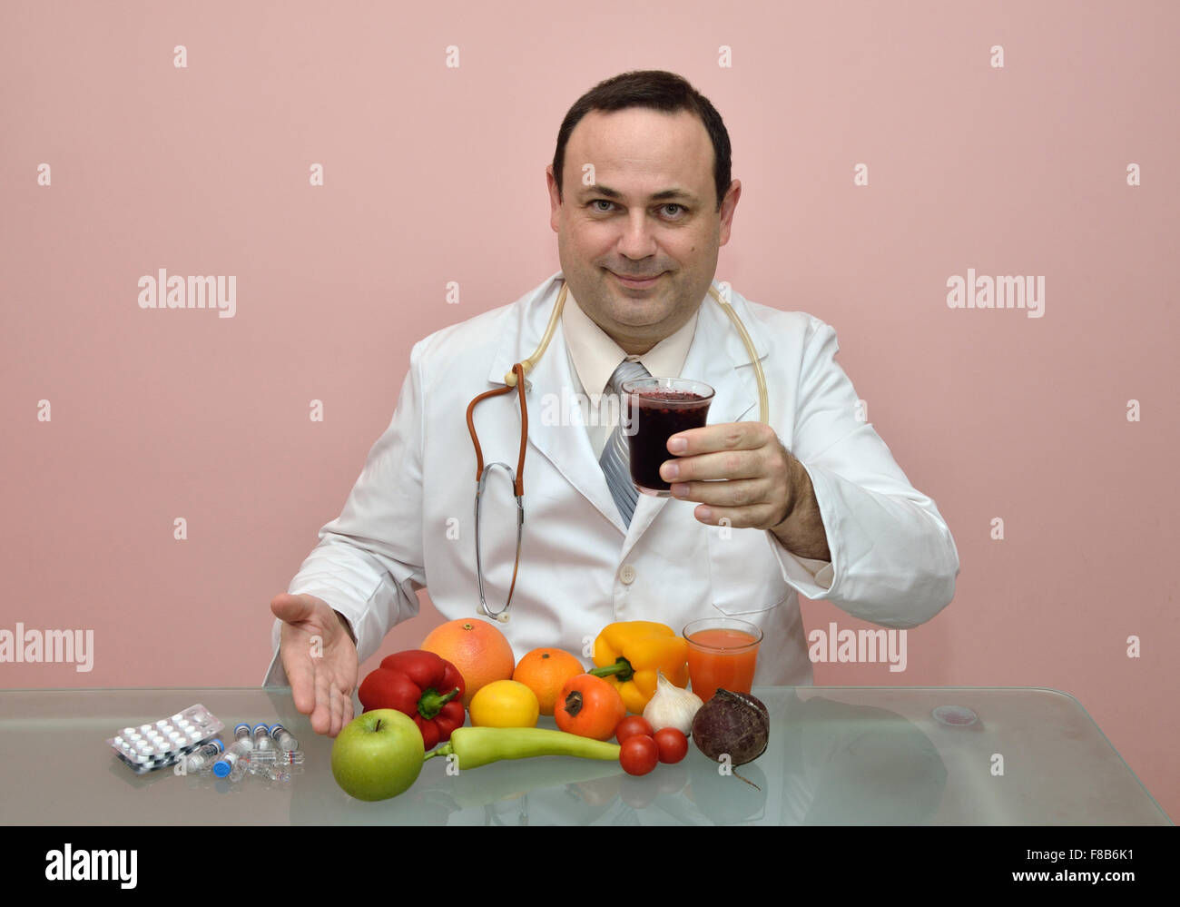 Doctor recommending fresh made natural juices and healthy food instead ...