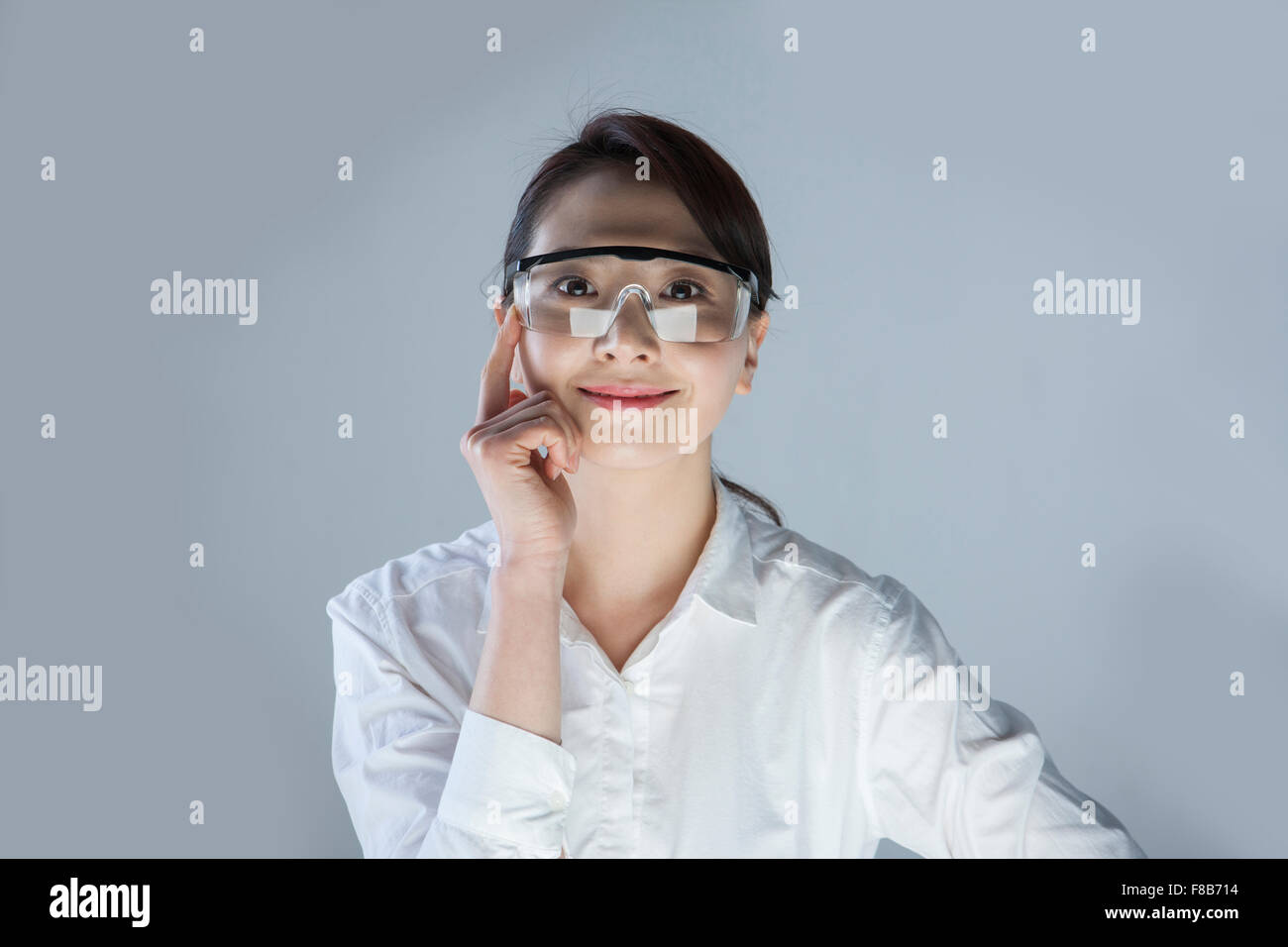 Business woman wearing goggles and staring forward with a smile Stock ...