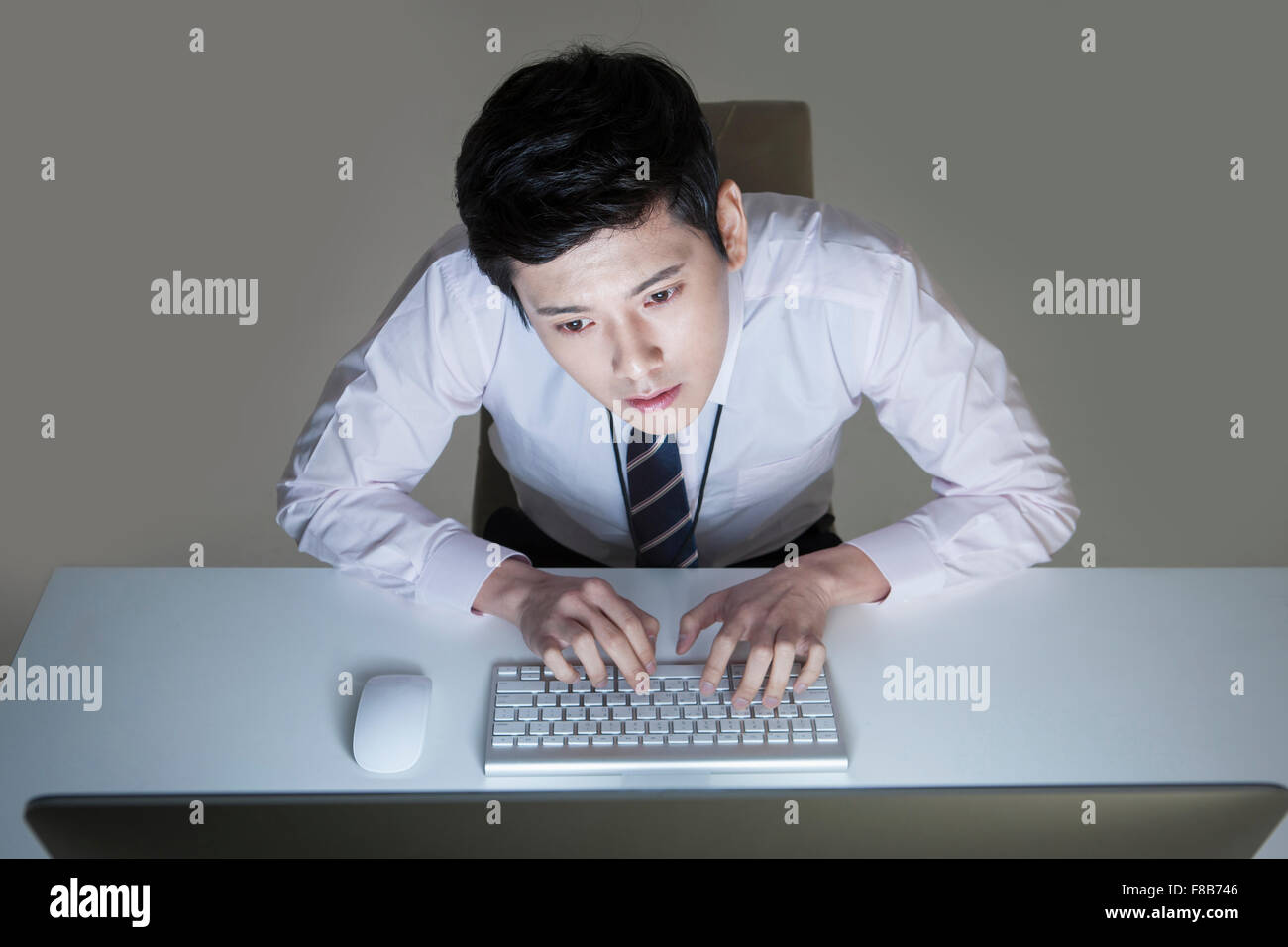 One asian man computer desk hi-res stock photography and images - Alamy