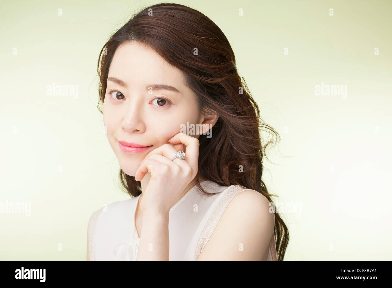 Woman with her hand on her cheek hi-res stock photography and images ...