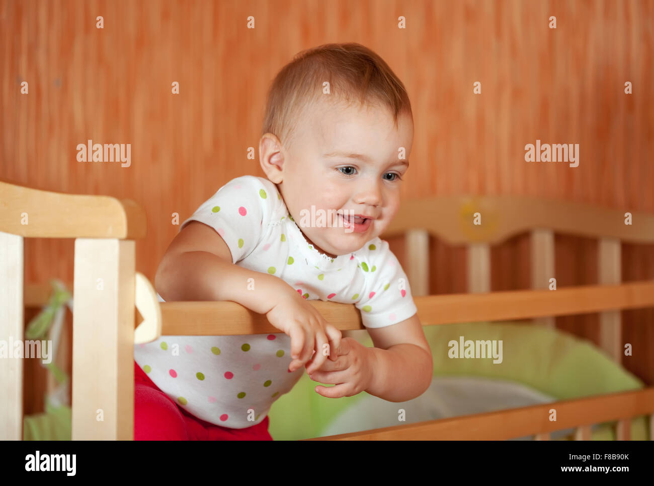 Calm baby in the crib Stock Photo - Alamy