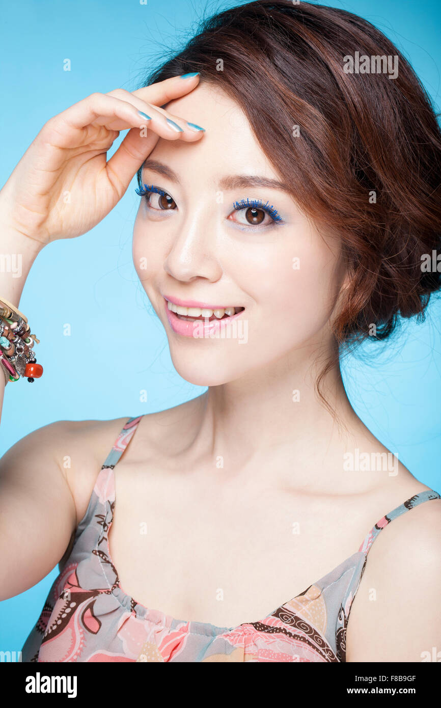 Asian woman in summer outfits putting her hand on her forehead with a ...