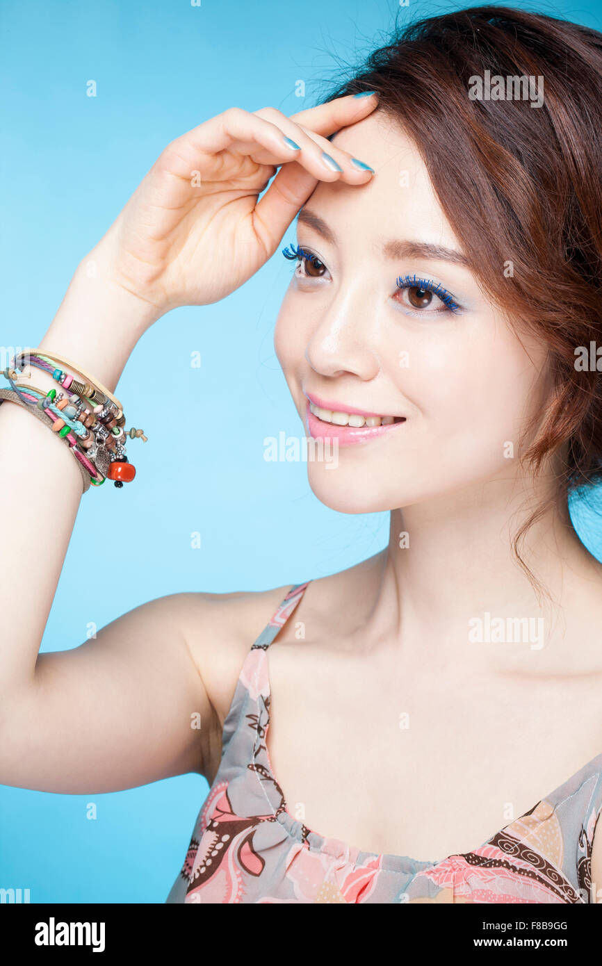 Asian woman in summer outfits putting her hand on her forehead with a ...