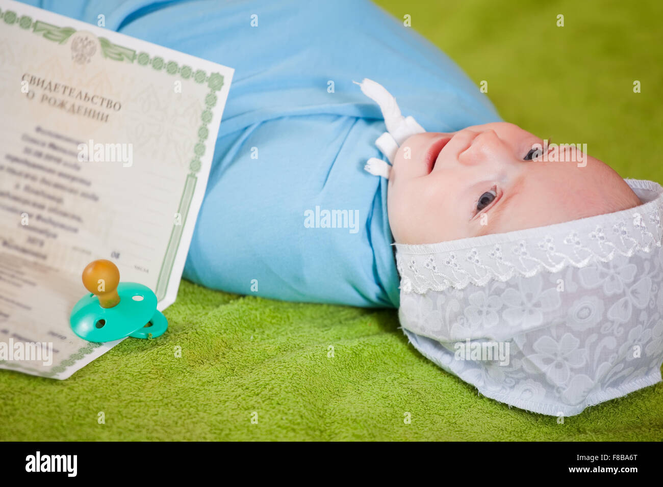 New born baby with certificate of birth Stock Photo - Alamy