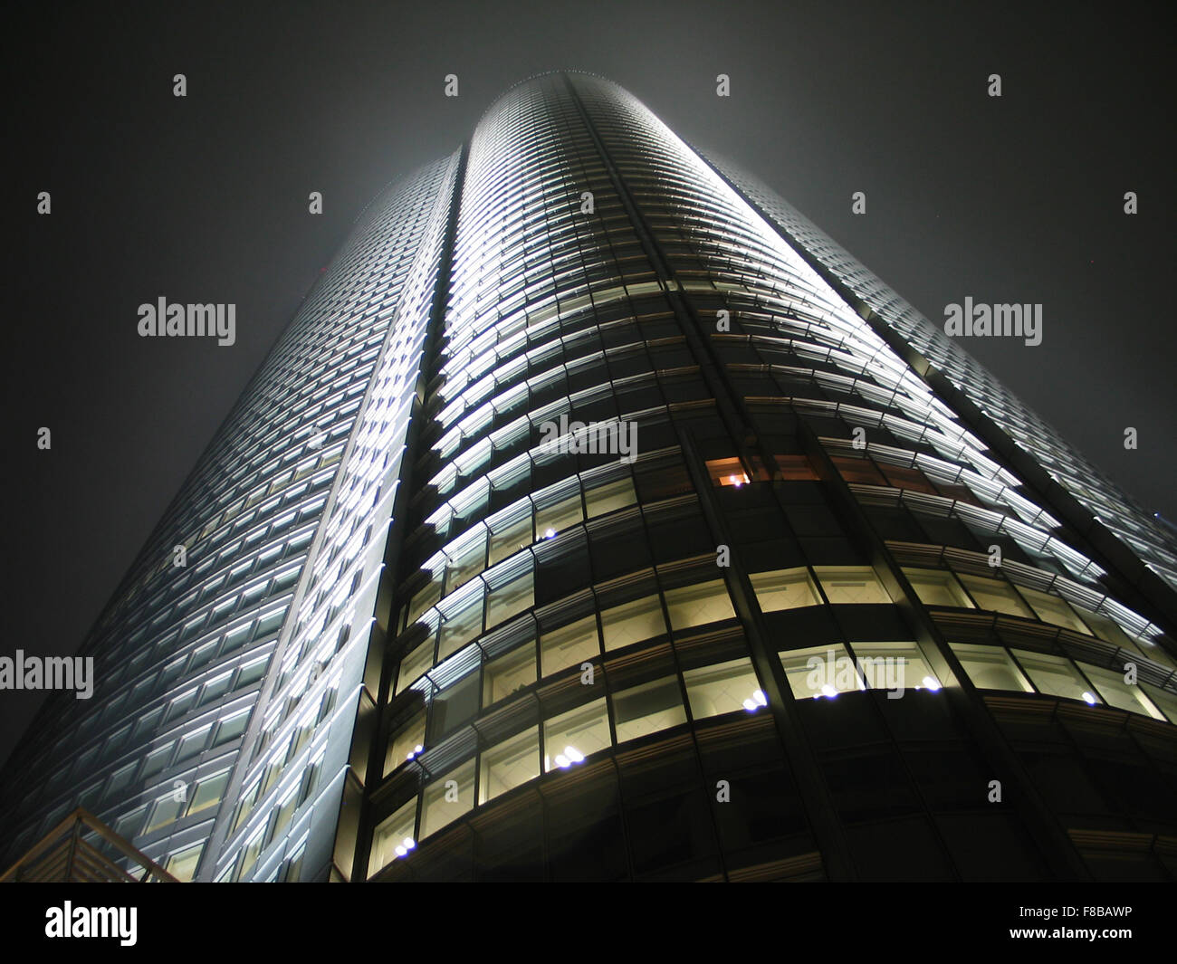 Skyscraper in the rain at night Stock Photo - Alamy