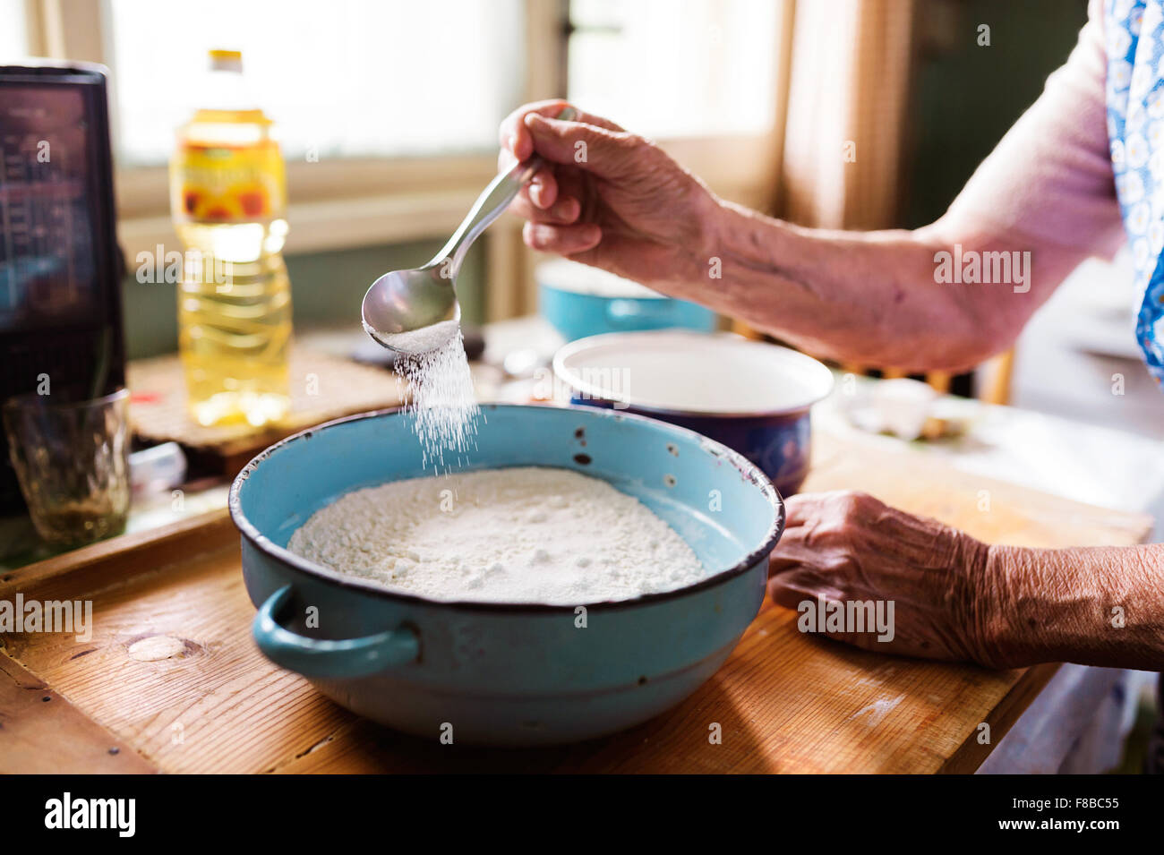 Old woman holding bread hi-res stock photography and images - Alamy