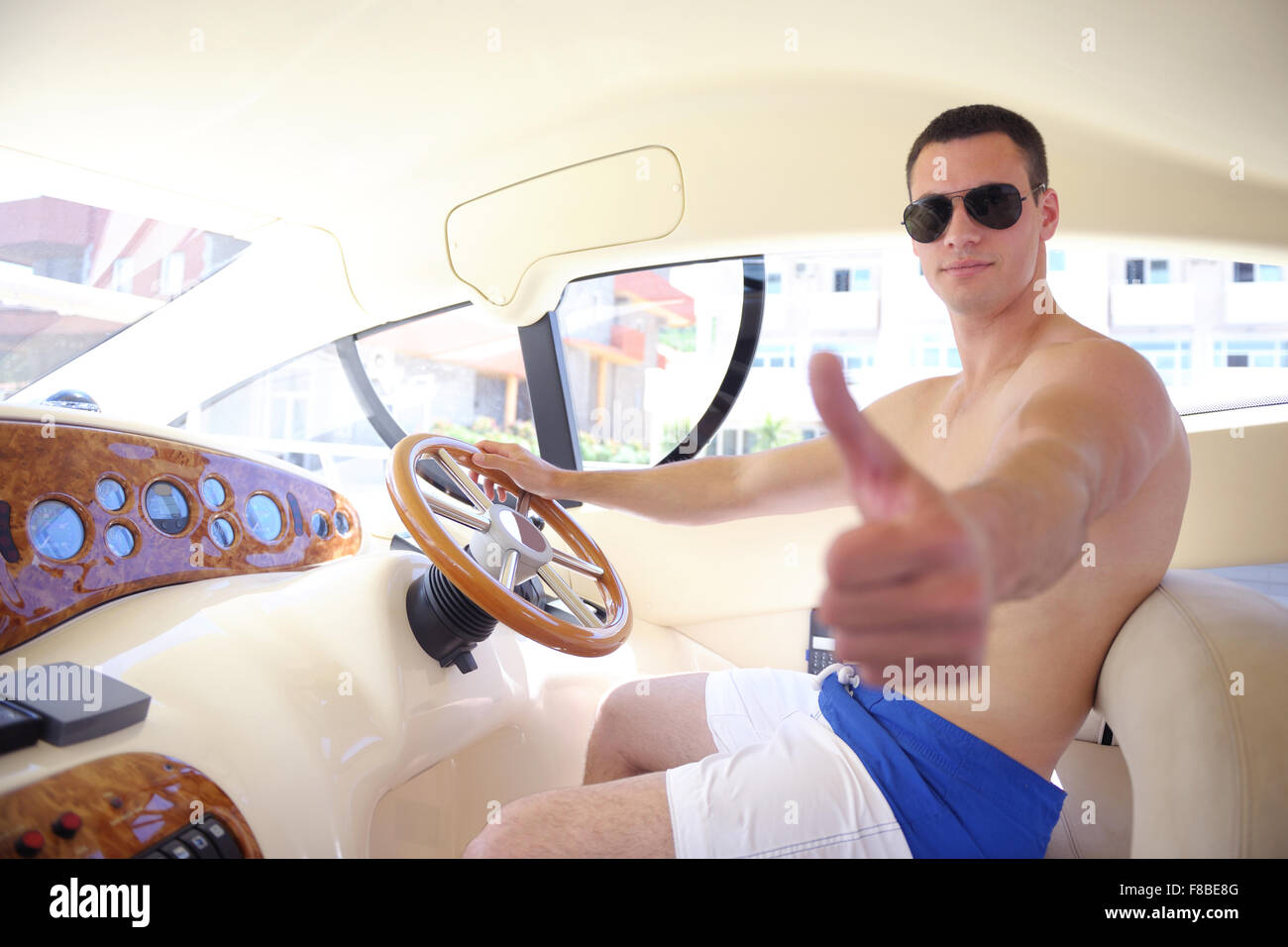 young happy man have fun on luxury boat yacht Stock Photo - Alamy