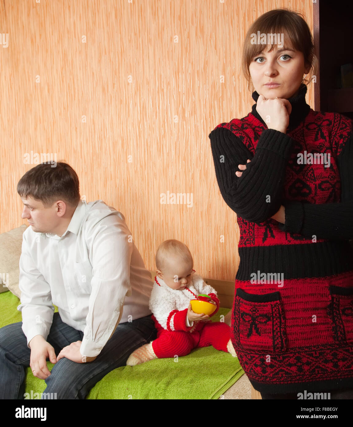 Family of three having quarrel at home Stock Photo - Alamy