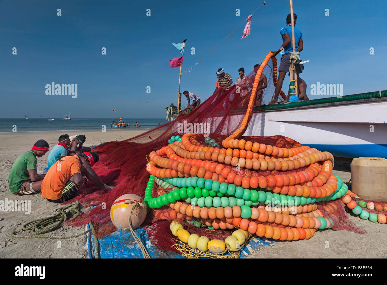 Fishermen tending their nets Colva Beach Goa India Stock Photo - Alamy