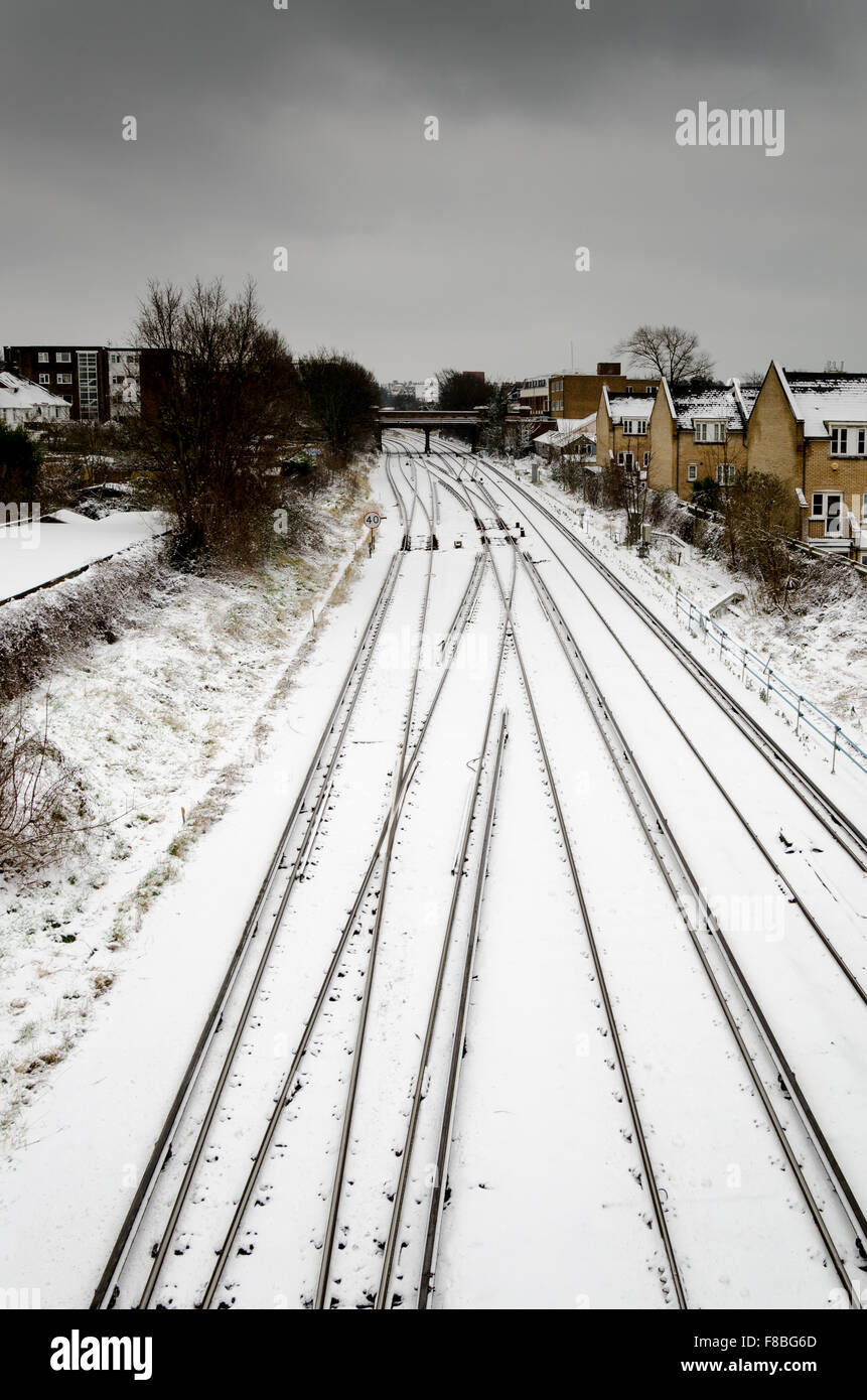 Snowfall on a railway line in winter under threatening skies Stock ...