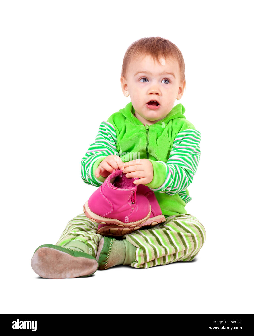 Year-old child holding shoes over white background Stock Photo - Alamy