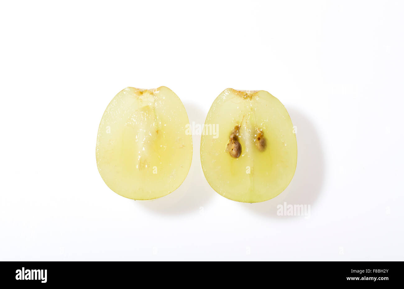 open ripe grape on a white background Stock Photo - Alamy