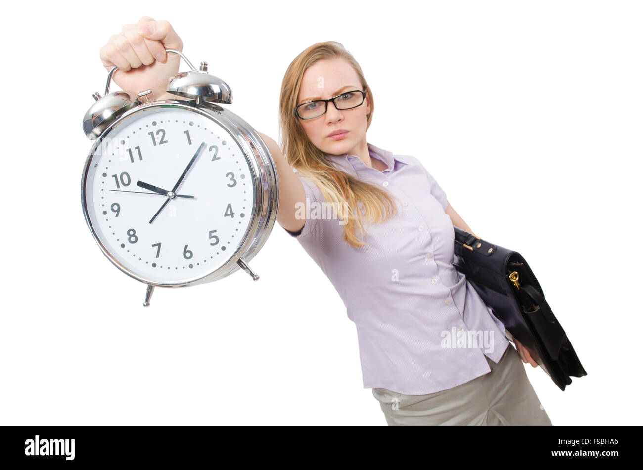 Young employee holding alarm clock isolated on white Stock Photo - Alamy
